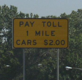 The first toll warning sign on the EB Skyway.